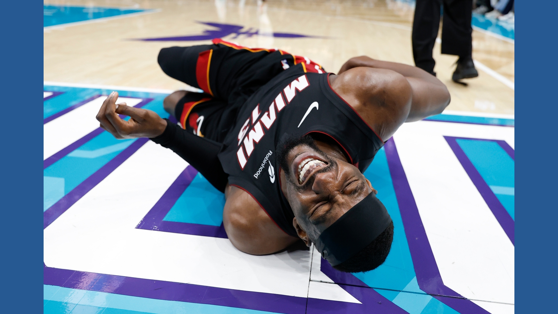Heat's Bam Adebayo taken to locker room after LaMelo Ball trips him ...