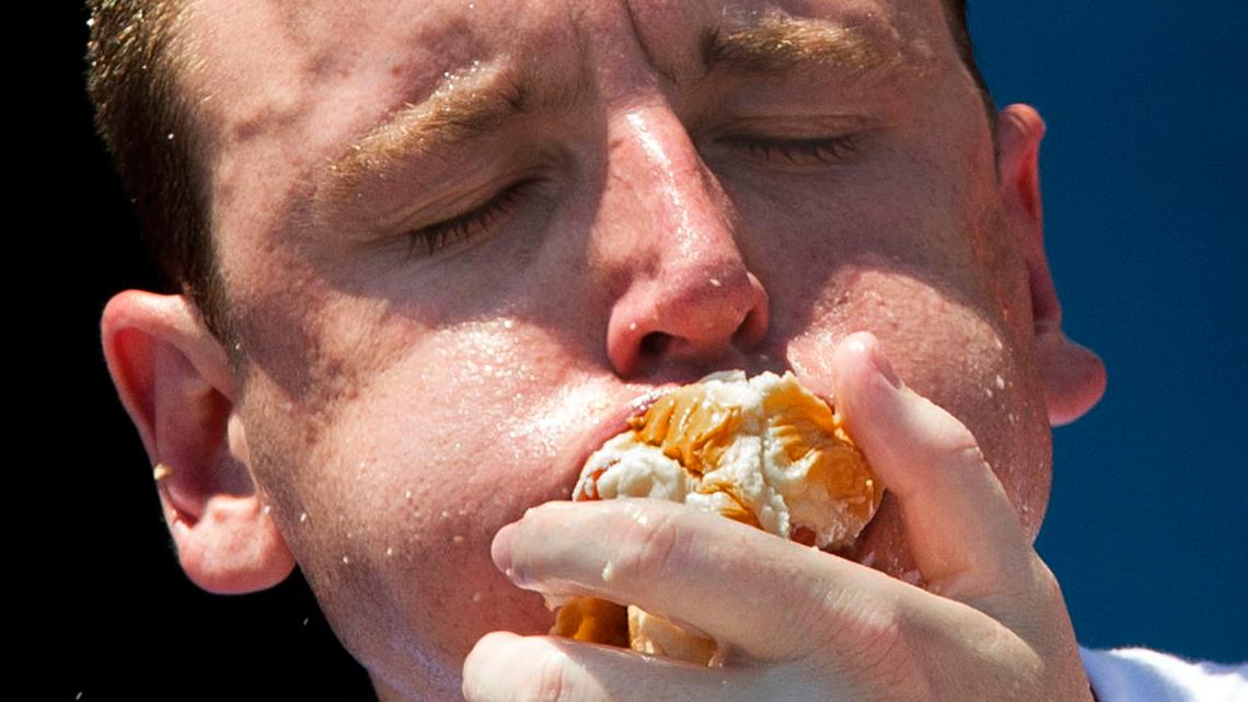 Joey Chestnut sets new world record in eating showdown with rival ...