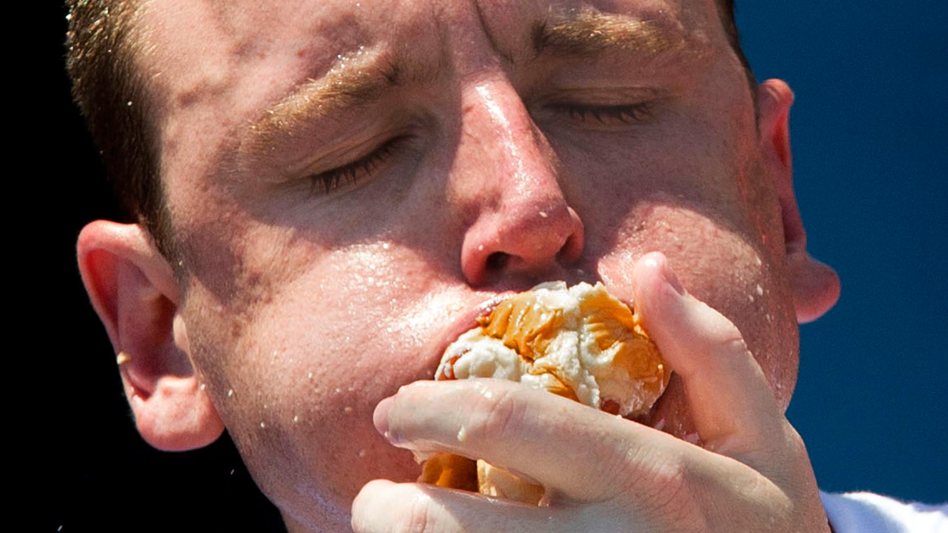 Joey Chestnut sets new world record in eating showdown with rival ...