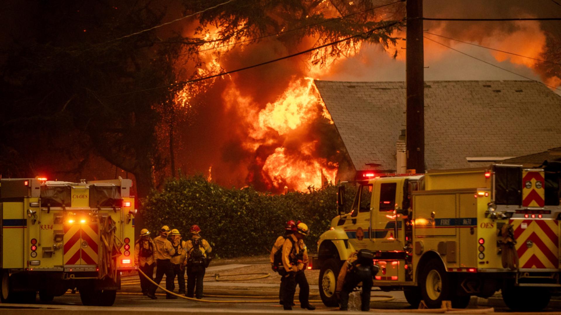 Firefighters battle devastating Los Angeles wildfires as winds calm ...
