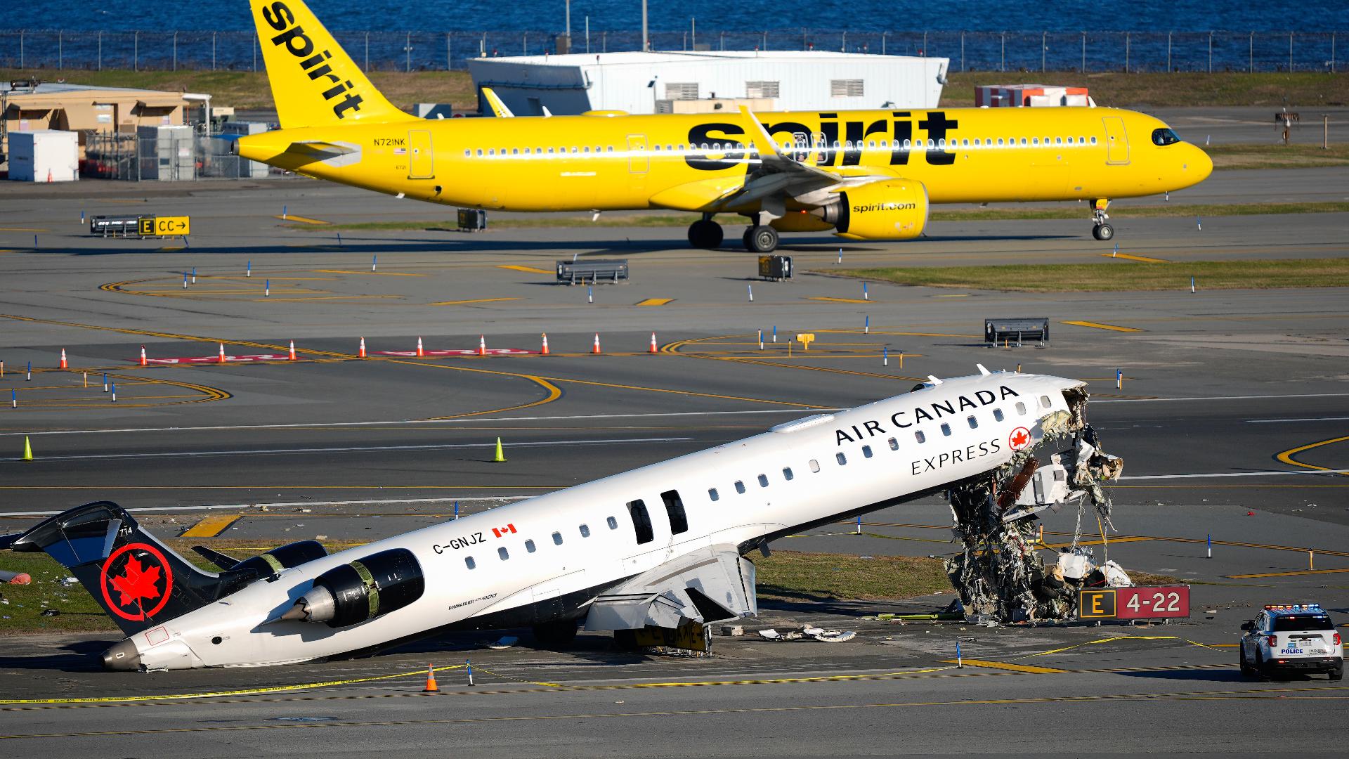 Plane in LaGuardia crash is towed from runway as most injured ...