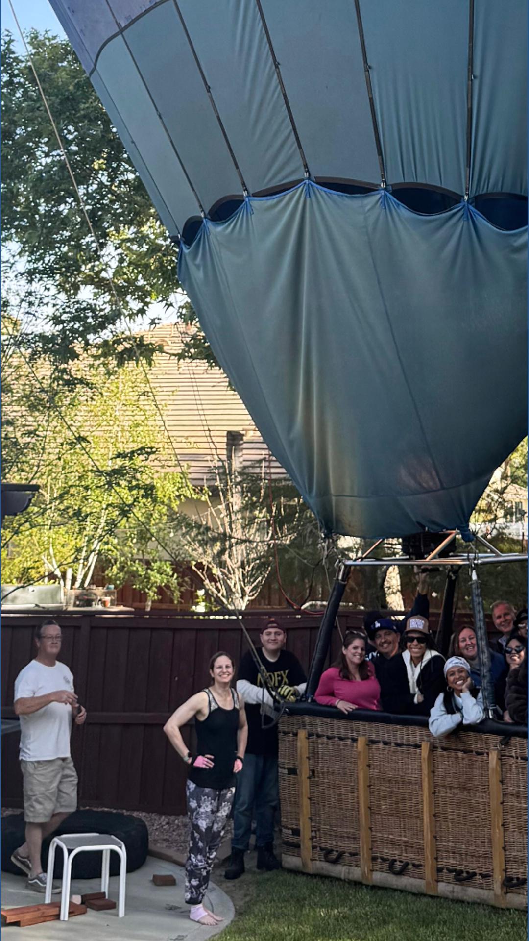 Mind if we drop in? Hot air balloon with 13 aboard makes emergency ...