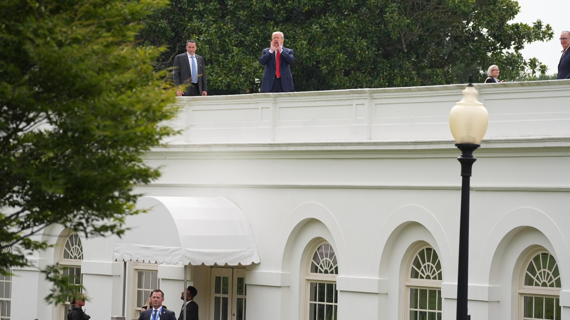 Trump appears on White House roof, shouts answers to reporter questions ...