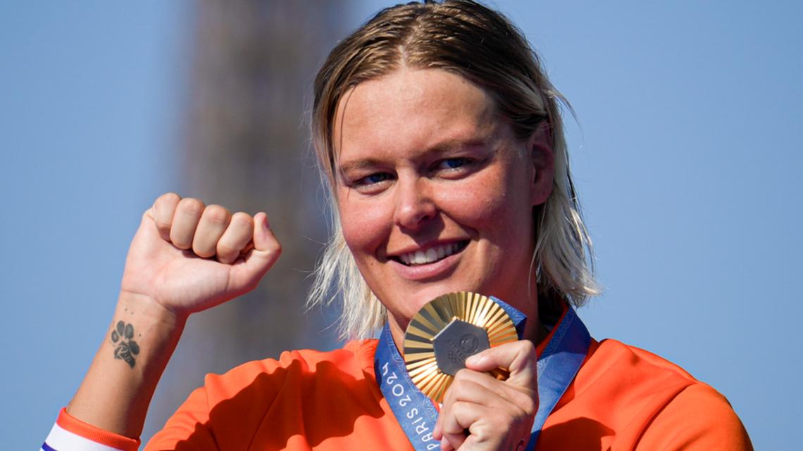 Netherlands' marathon swimmer dedicates gold medal to late dog | wthr.com