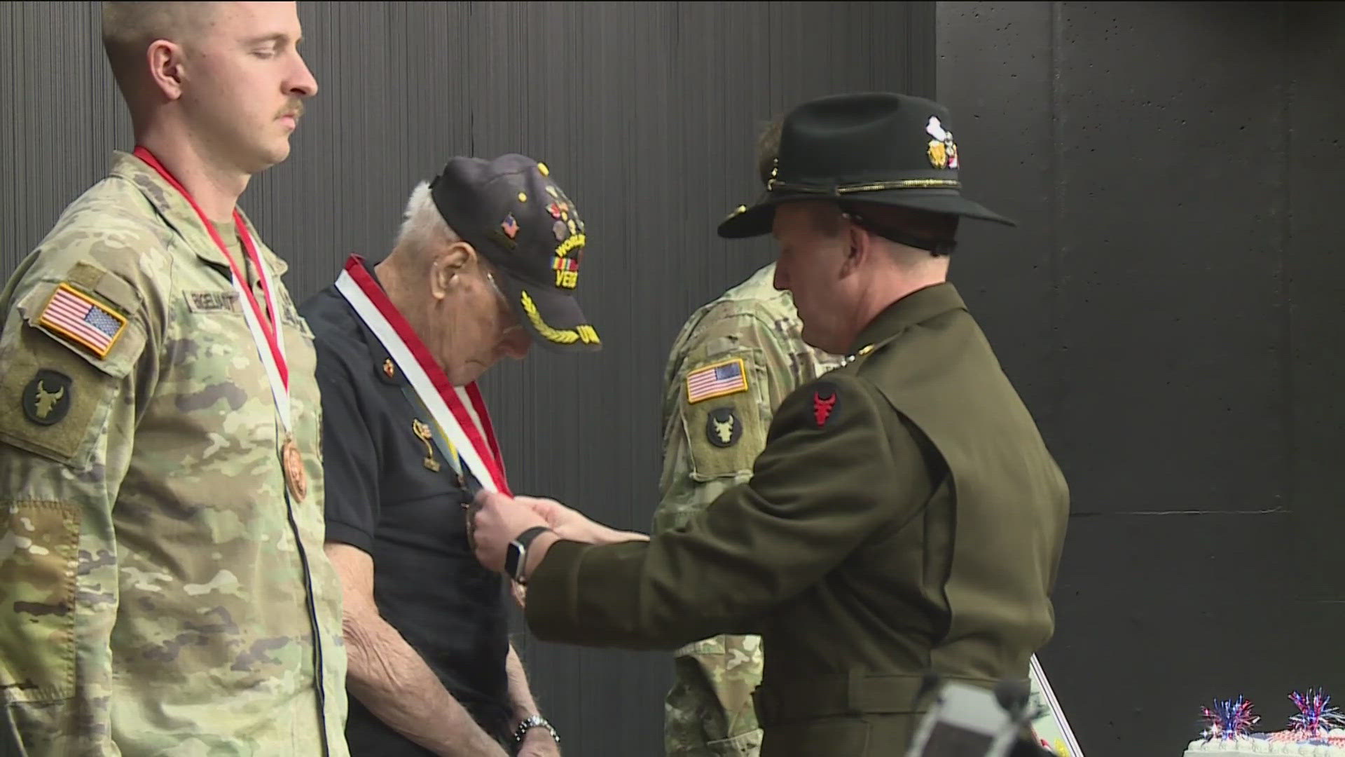 WWII veteran surprised with honor on his 102nd birthday | wqad.com