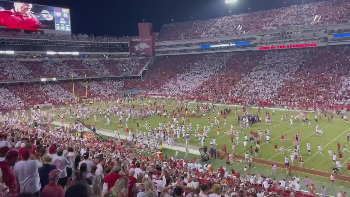 Razorback fans storm the field after historic win over #15 Texas ...