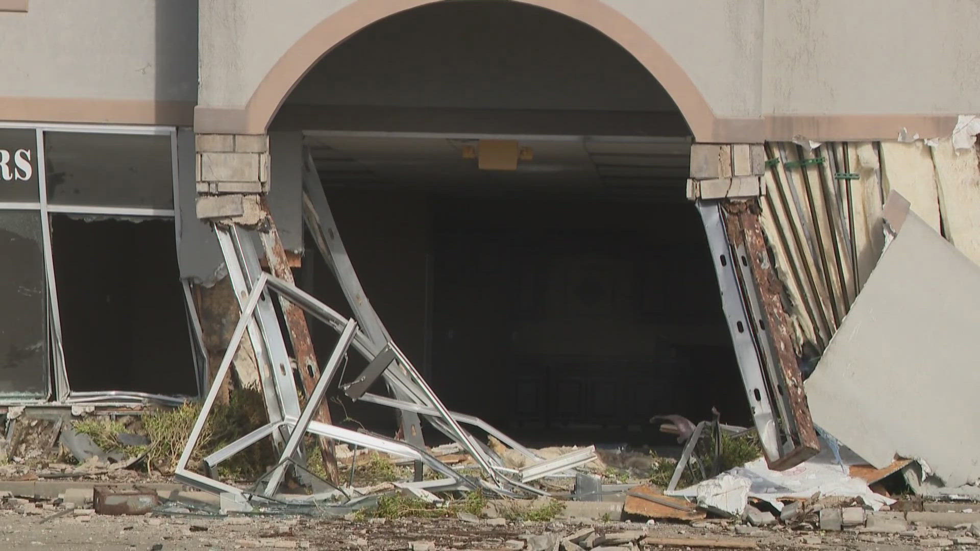 Three people hospitalized after car crashes into building in Rogers ...