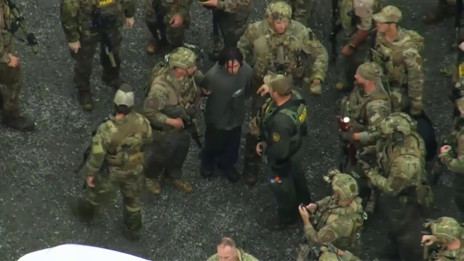 Police group photo with captured inmate draws criticism | 5newsonline.com