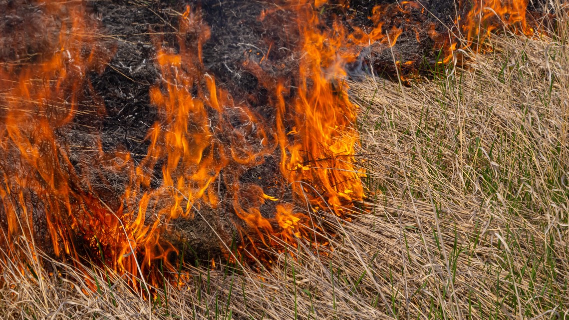 Des Moines police, fire crews respond to grass fire at 63rd and Grand ...