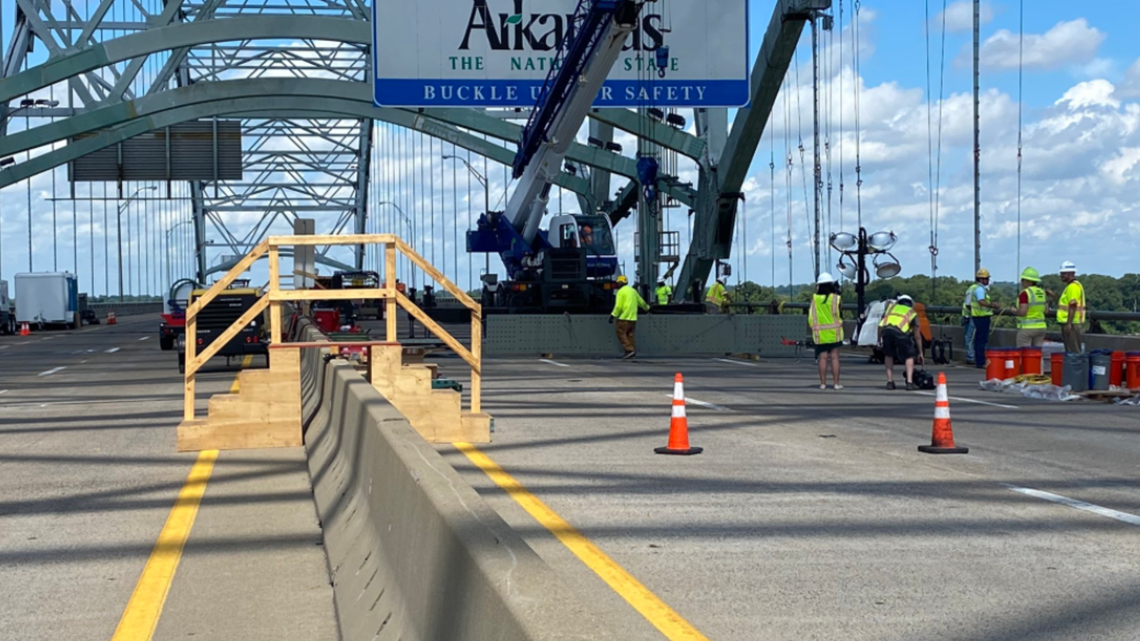 Construction crews install steel plates on cracked I-40 bridge ...