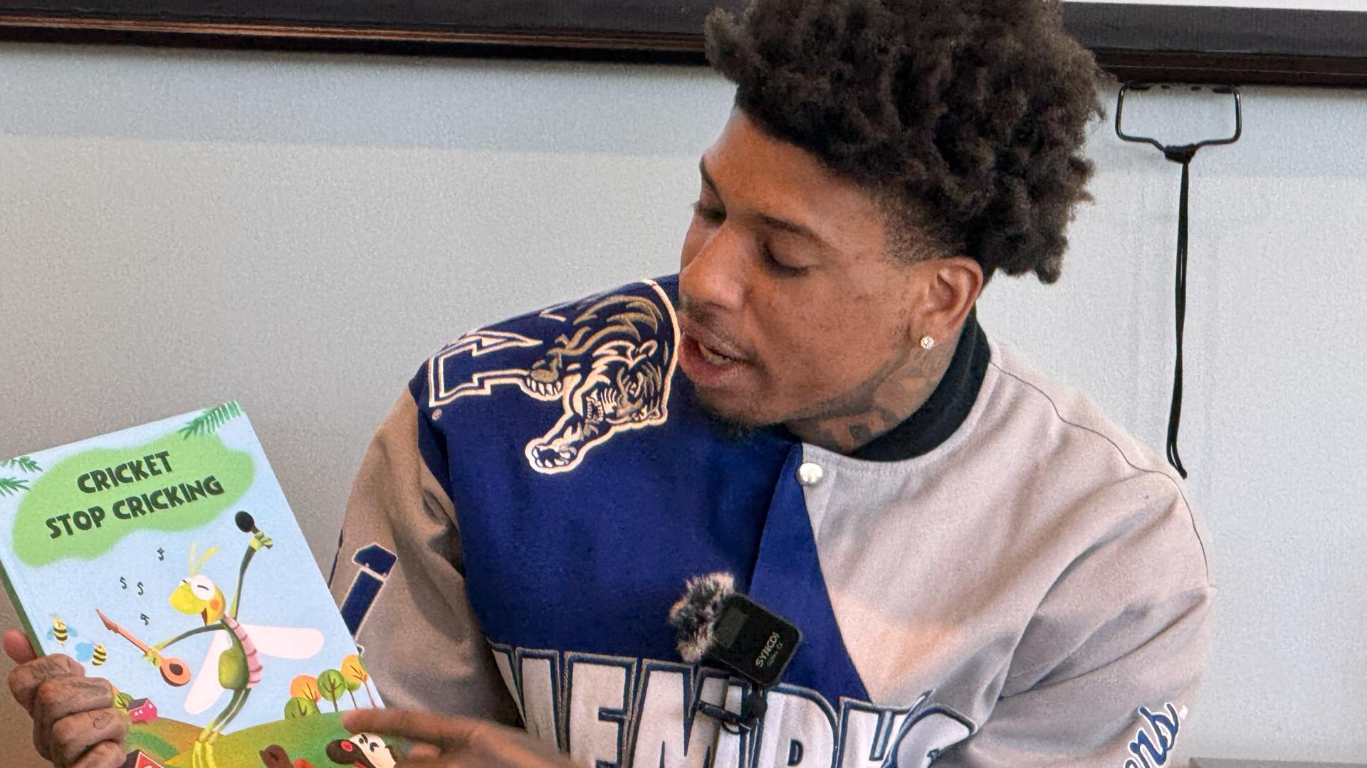 NLE Choppa reads book to children during egg hunt | localmemphis.com