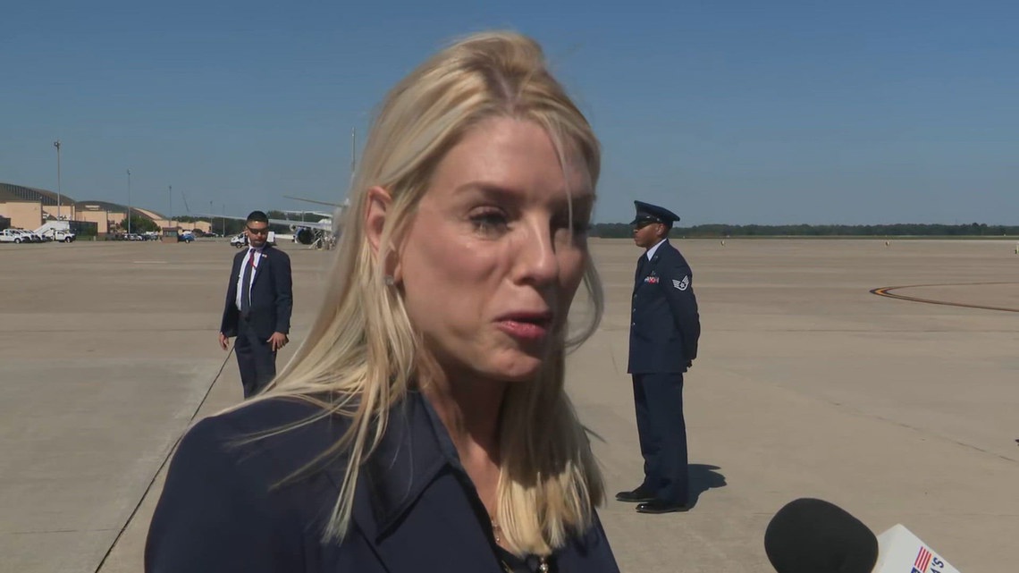 U.S. Attorney General Pam Bondi speaks with reporters before hopping on ...