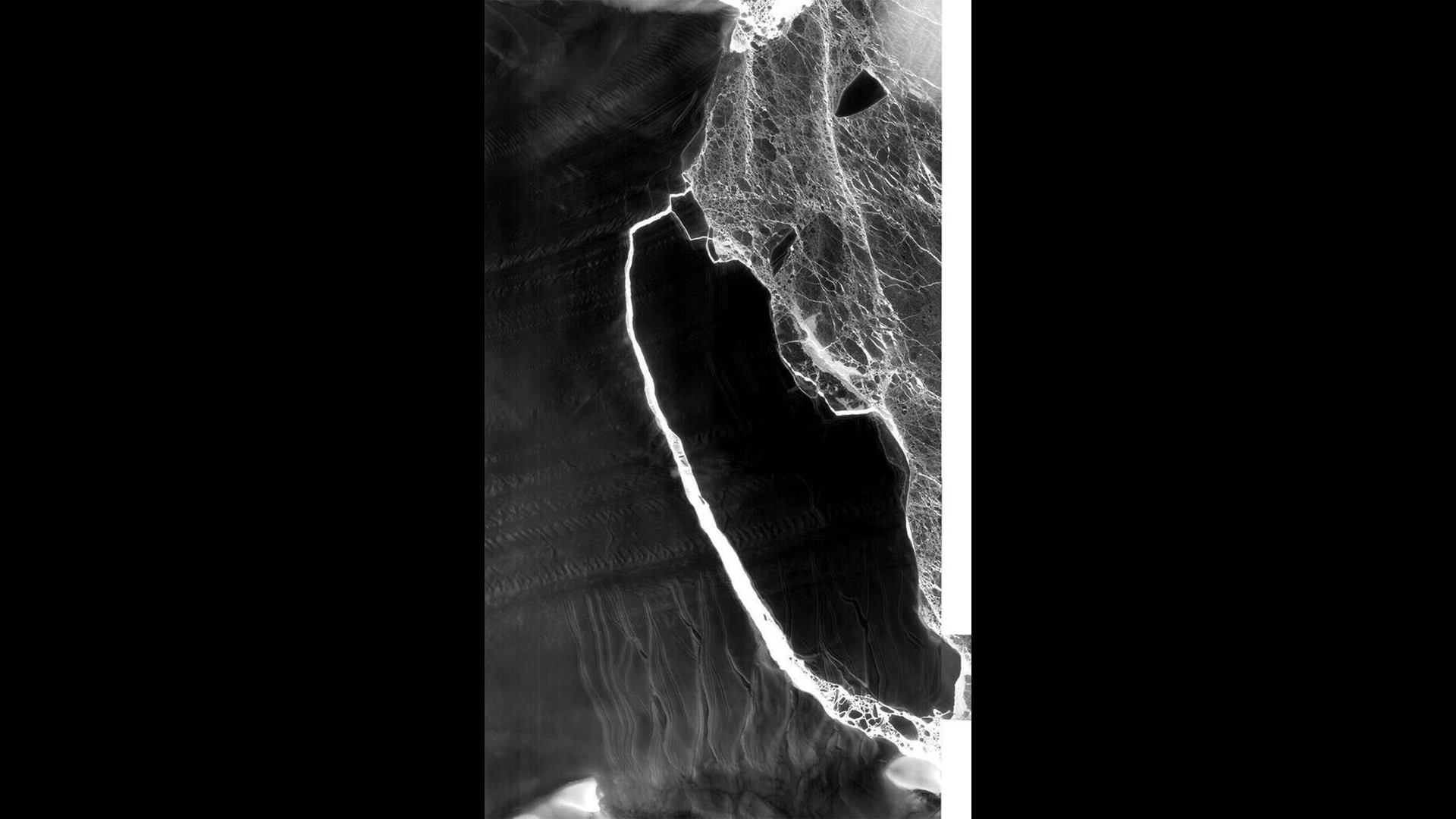 Huge iceberg shown breaking up in NASA satellite's infrared image ...