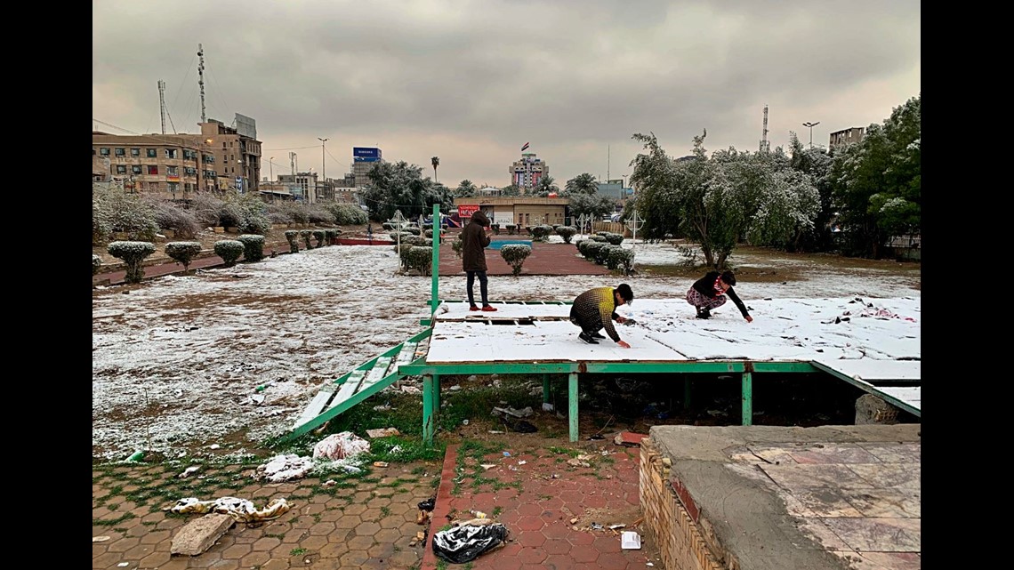 People in Baghdad wake up to snow for first time in over a decade ...