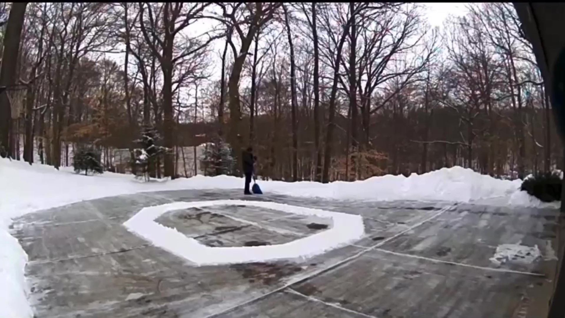 Man shovels Script Ohio, Block O in snow following Monday's storm ...
