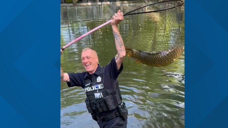 WATCH: Wooster police officer helps boy catch 15-pound fish ...