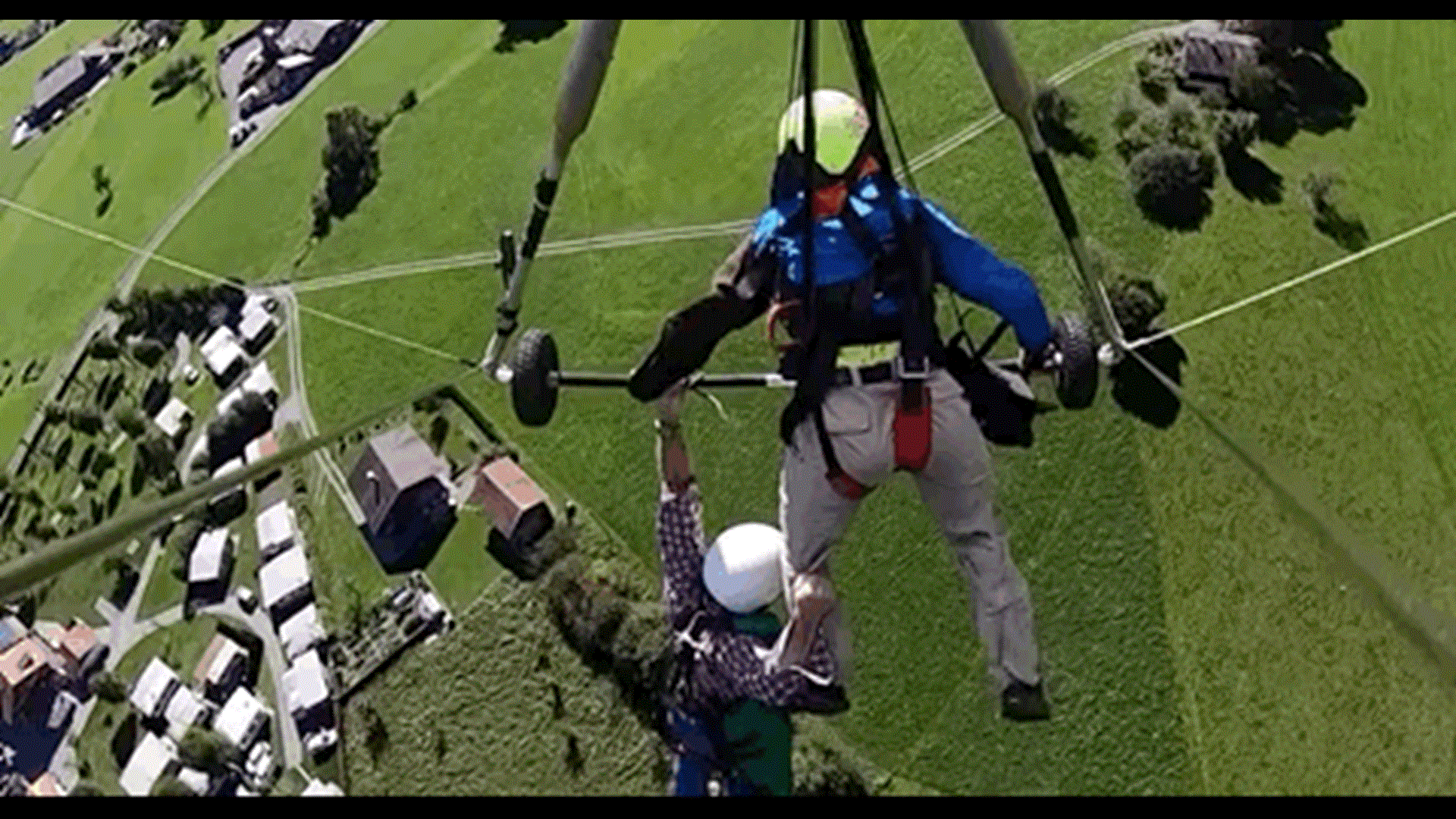 First-Time Hang Glider Hangs on for Dear Life After Pilot Forgets to ...