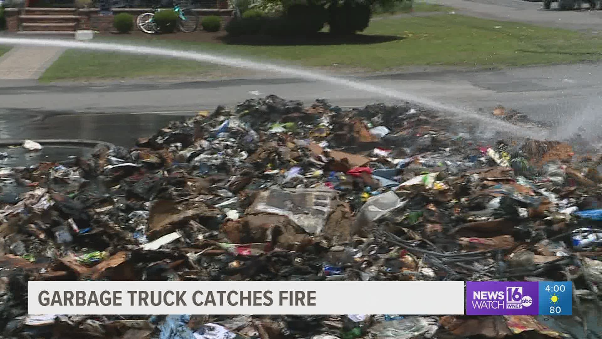 Garbage truck dumps load in parking lot | wnep.com