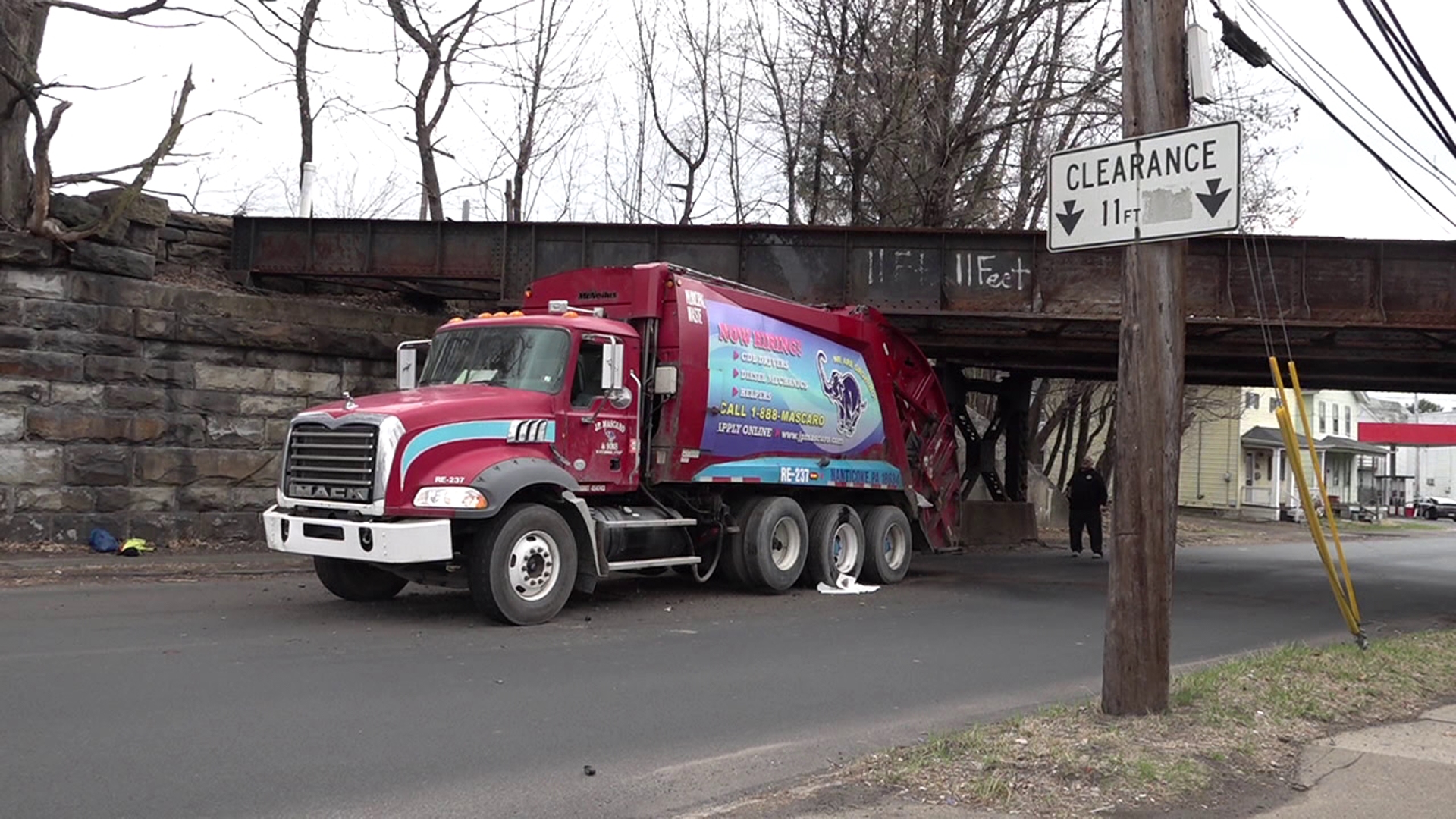 Trash truck wedged under bridge in Scranton | wnep.com