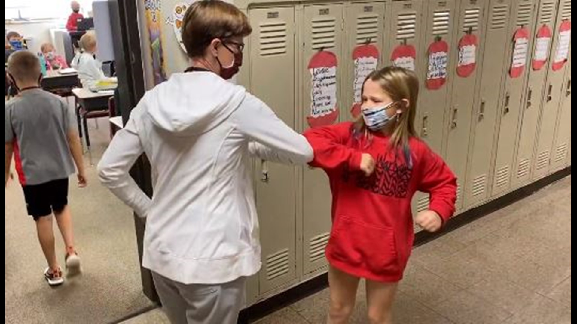 Elementary school teacher greets students with custom handshakes | 10tv.com