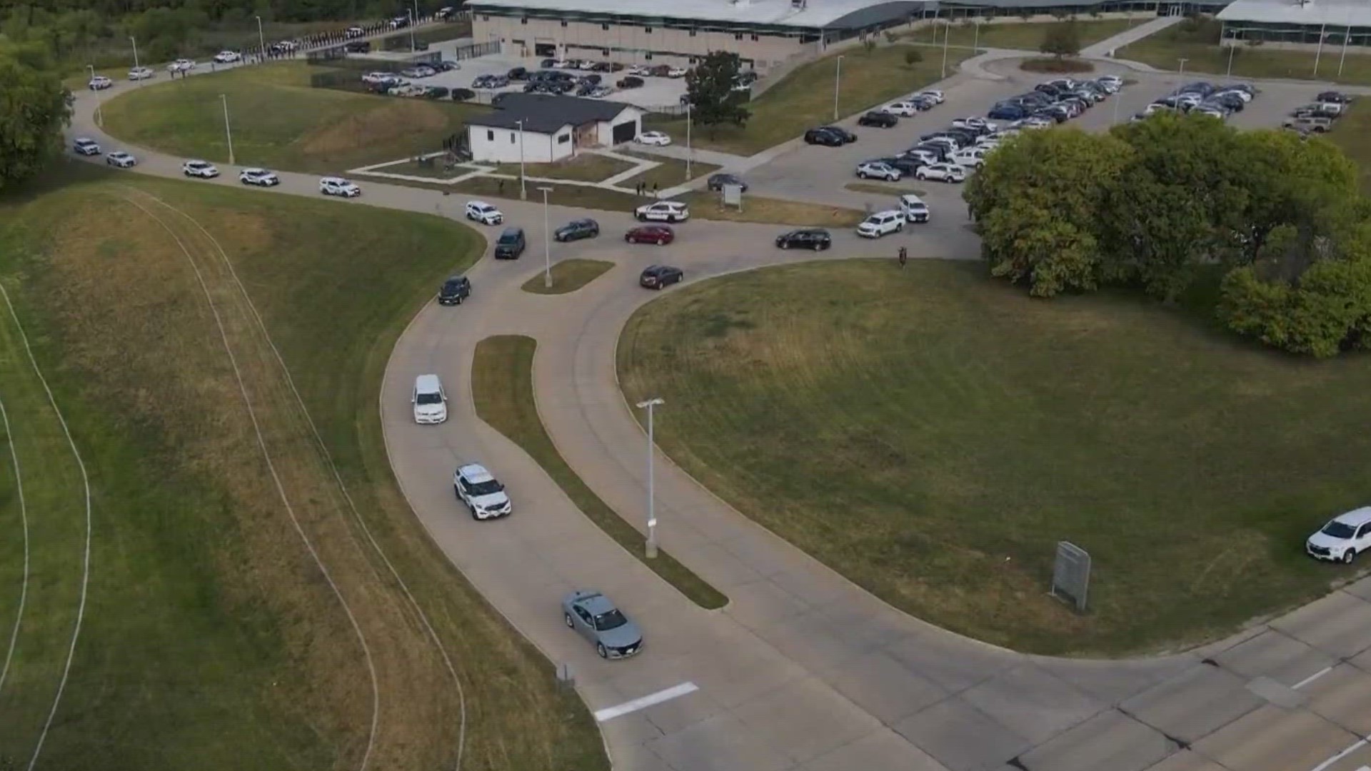 Police escort Ofc. Kevin Cram's body back to Algona | weareiowa.com