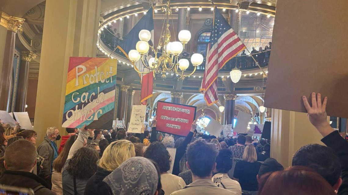 Iowa's governor signs a bill removing gender identity protections from ...