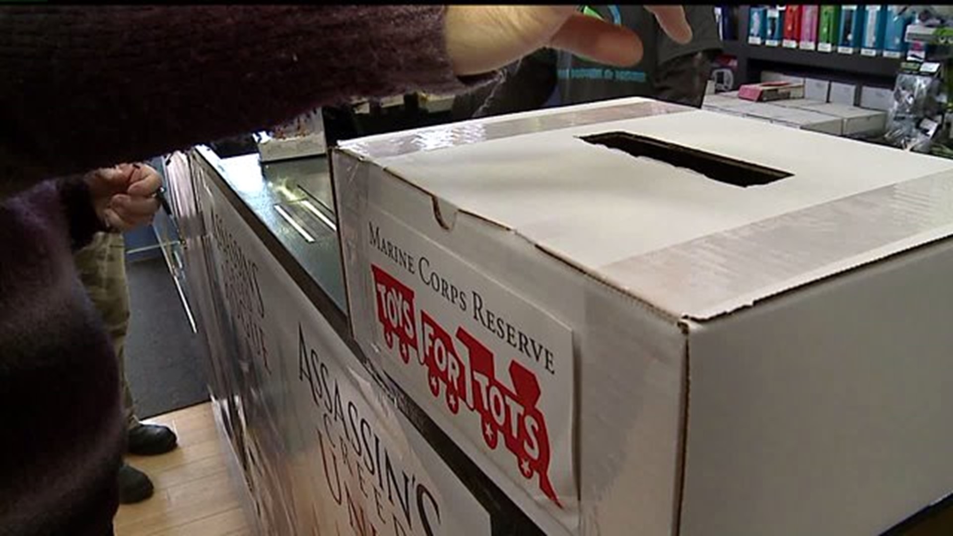 Surveillance video shows man stealing Toys for Tots donation jar in ... Surveillance video shows man stealing Toys for Tots donation jar in ...