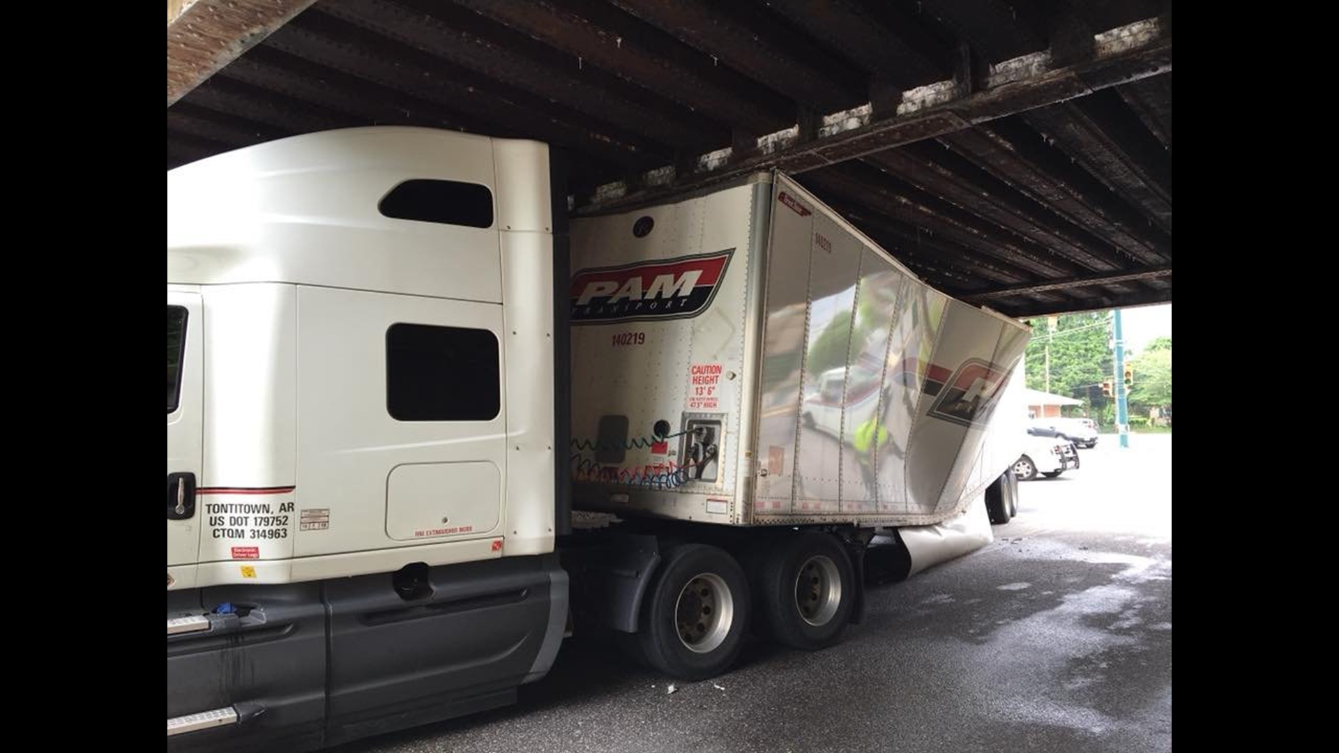 Tractor trailer stuck under railroad bridge in Carlisle Borough | fox43.com