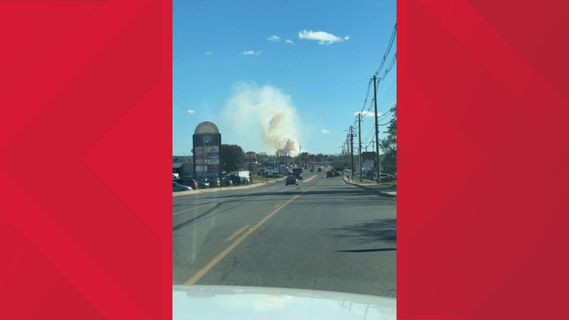 Crews fight large field fire started by burning trash and debris in ...