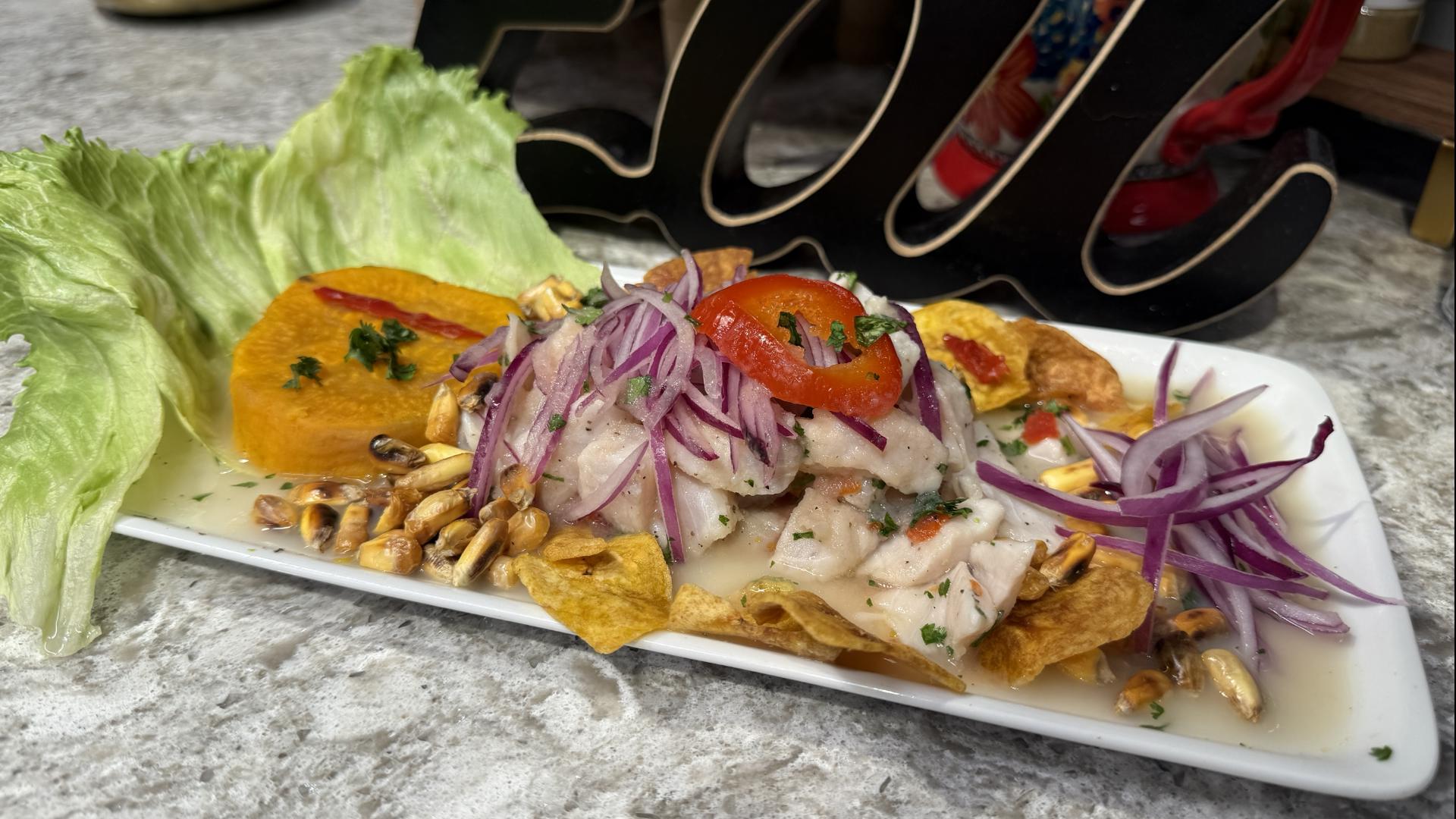 Chellas Arepa Kitchen prepares a Peruvian ceviche dish | fox43.com