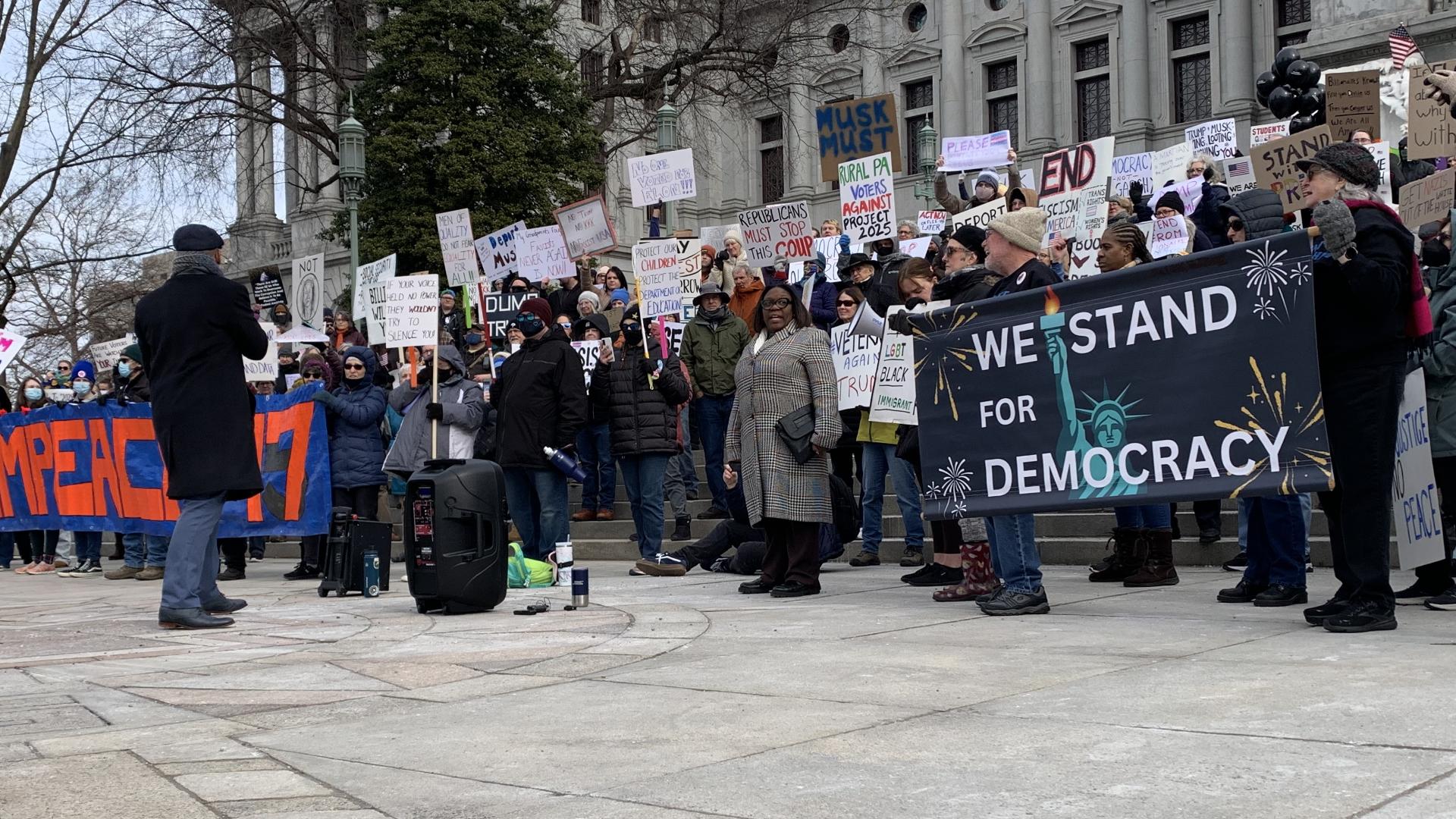 Hundreds of people protest the Trump Administration at the State ...