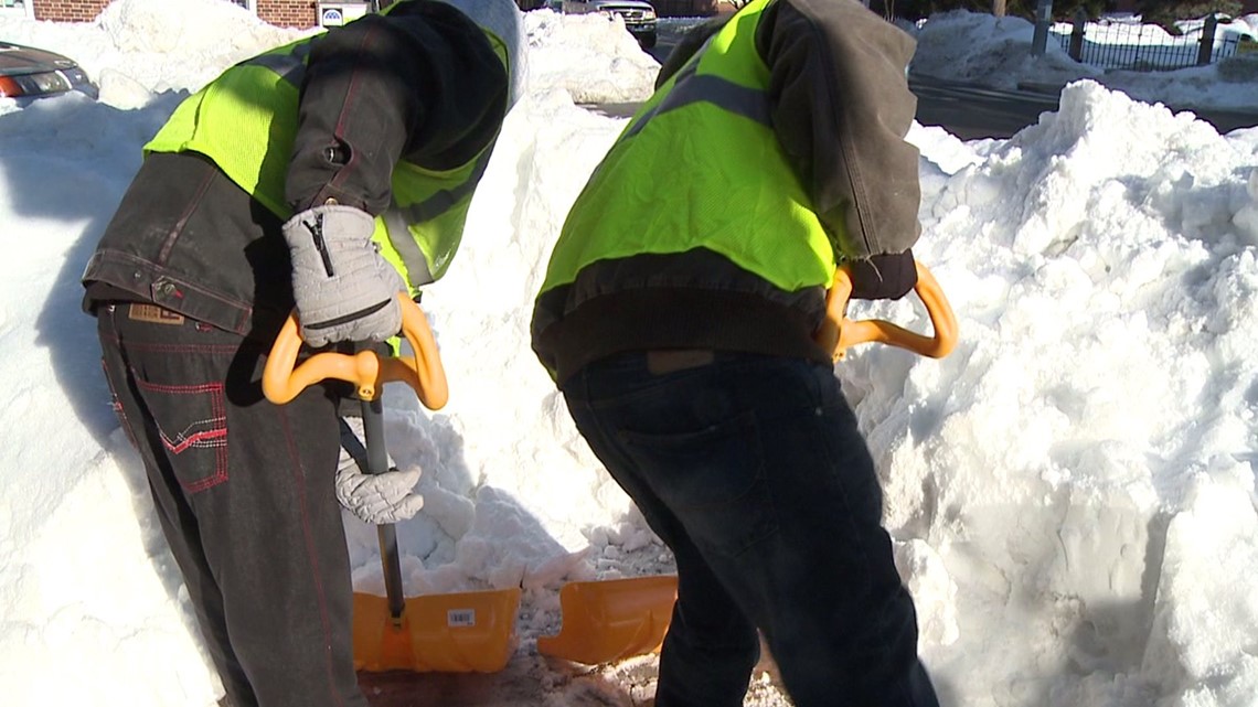 Prison inmates help dig out crosswalks and sidewalks buried under snow ...