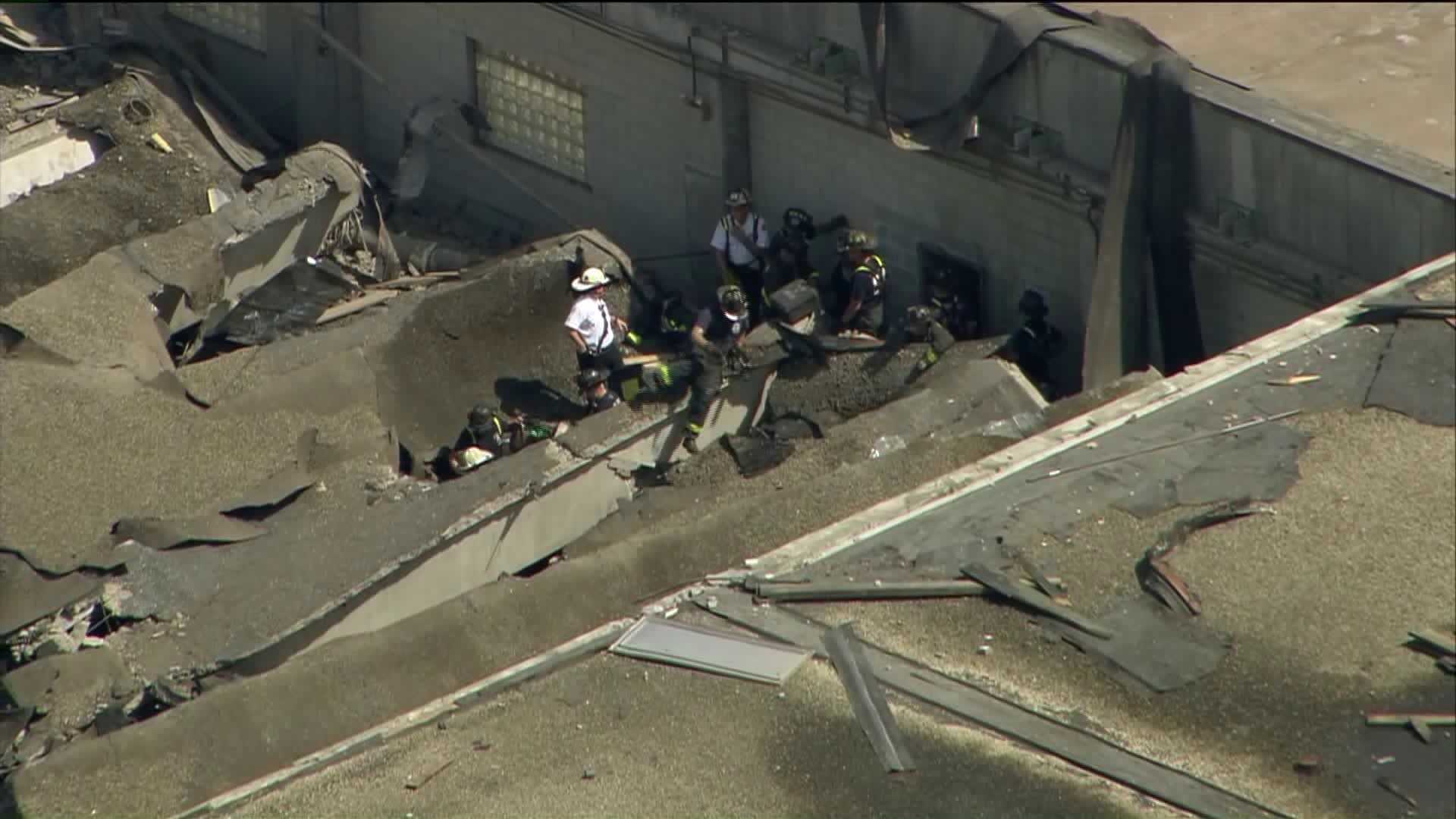 At least one person trapped after explosion, building collapse in ...