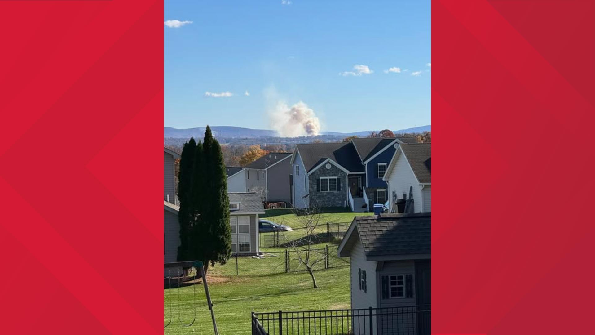 Crews fight large field fire started by burning trash and debris in ...
