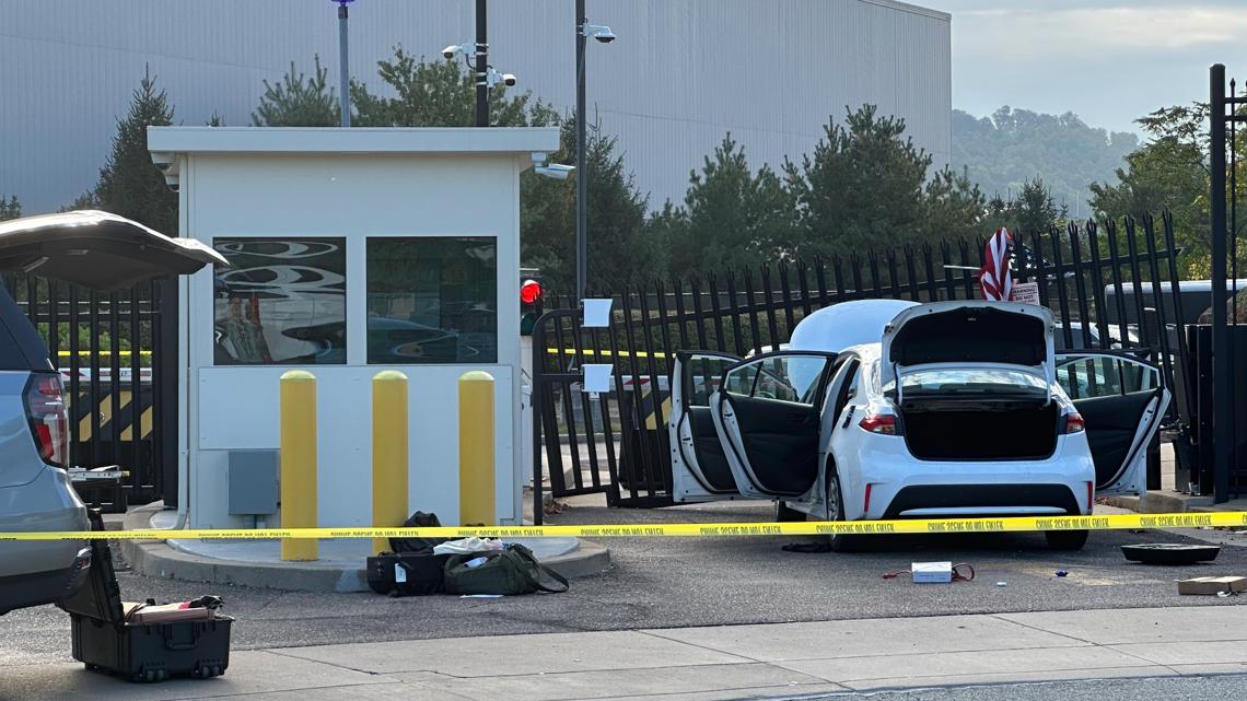 Suspect in custody after driver rams car into staffed security gate at ...