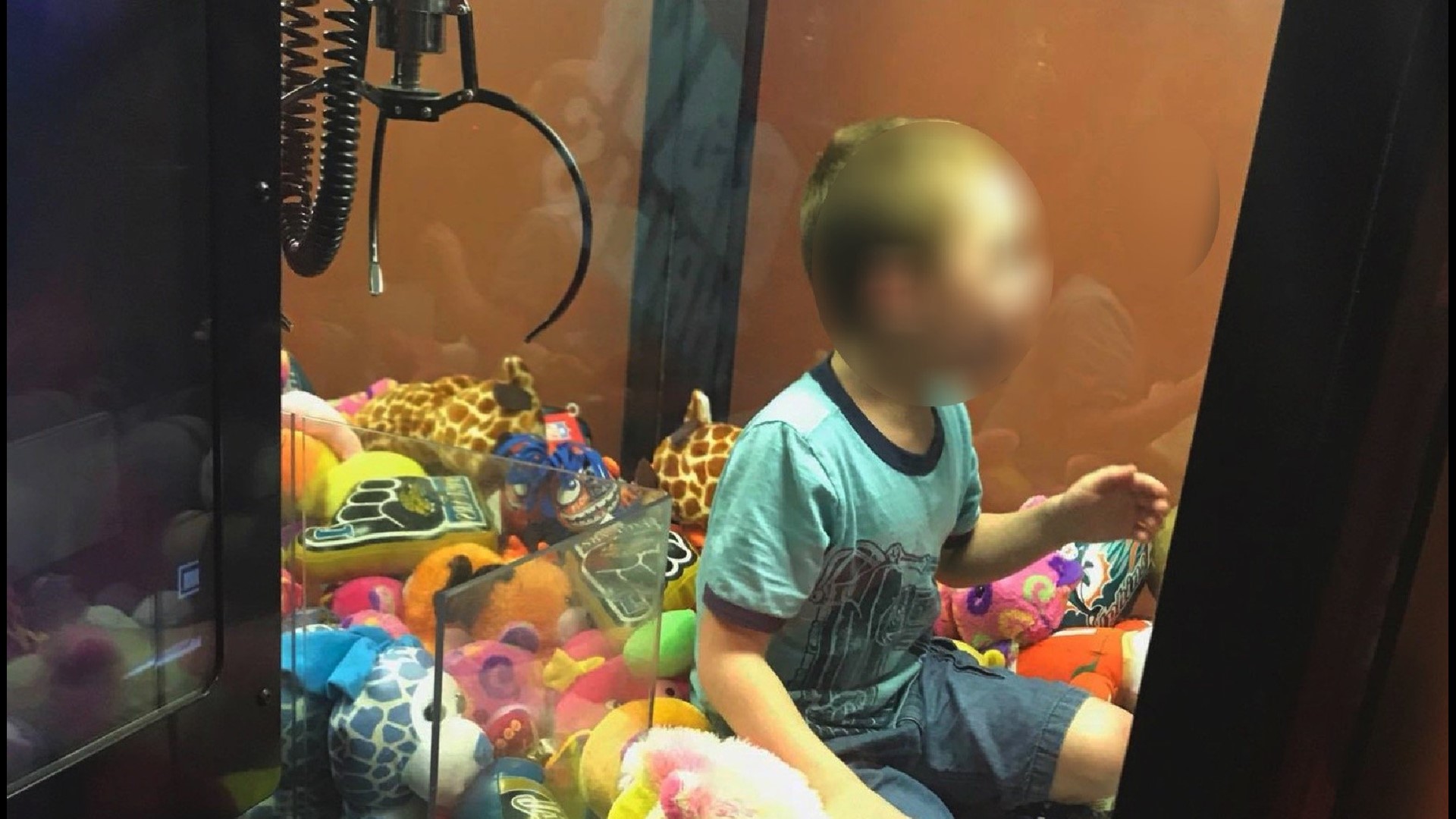 Boy trapped inside claw machine rescued by firefighters | fox43.com