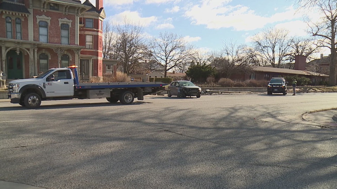 Bystanders help flip car over following crash in Davenport | wqad.com