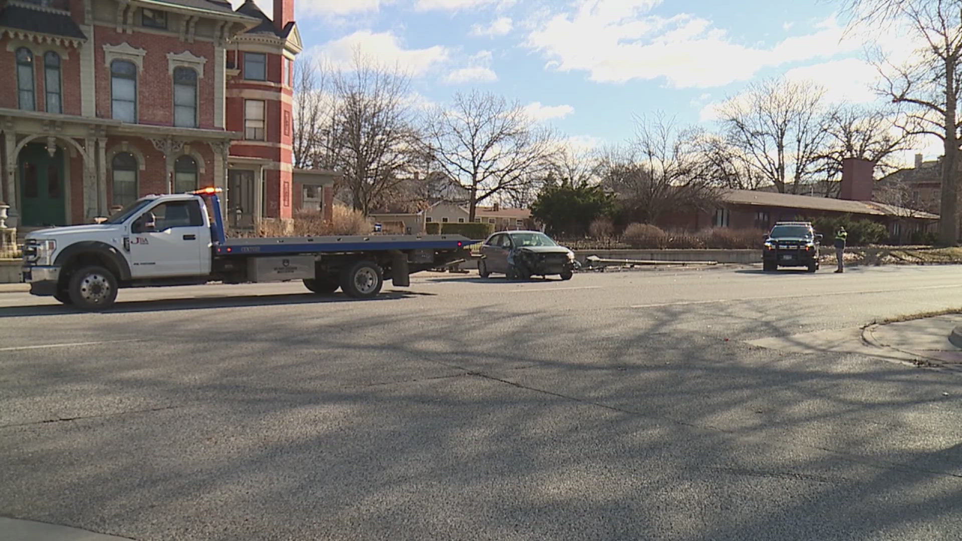 Bystanders help flip car over following crash in Davenport | wqad.com