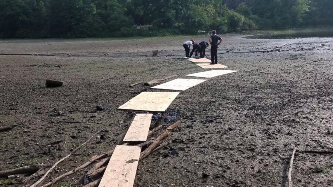Firefighters use plywood, rope to rescue children from quicksand-like ...