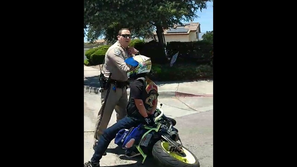 Video shows California trooper knocking down motorcyclist after freeway ...