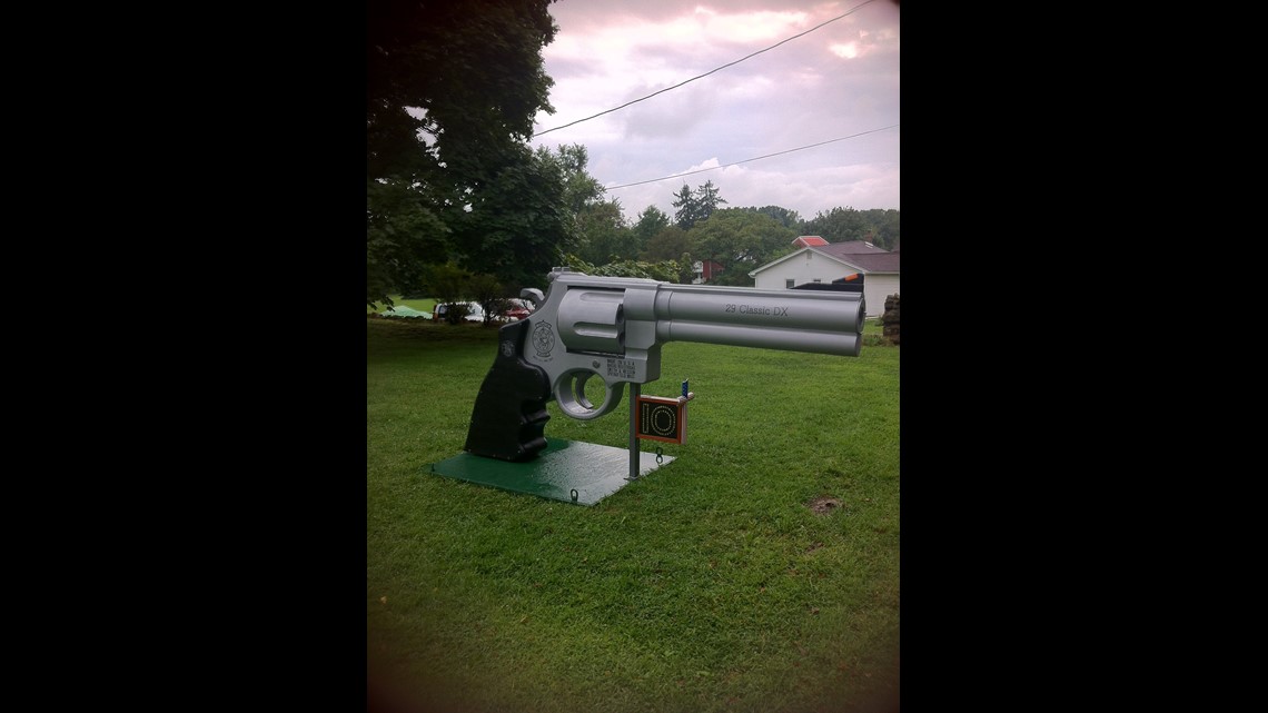 Creative craftsman builds mailbox to look like a giant gun | wqad.com