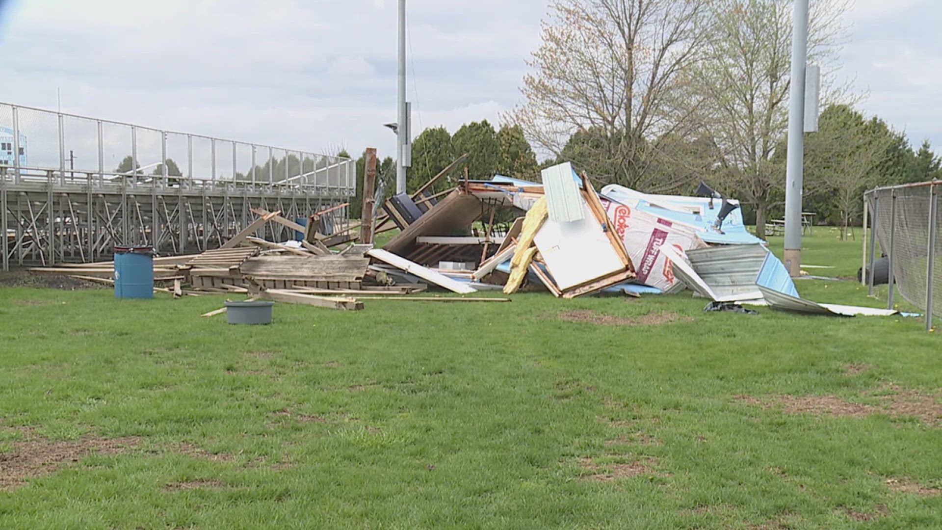 Grain bin, debris blown onto football field during Tuesday's storms in ...