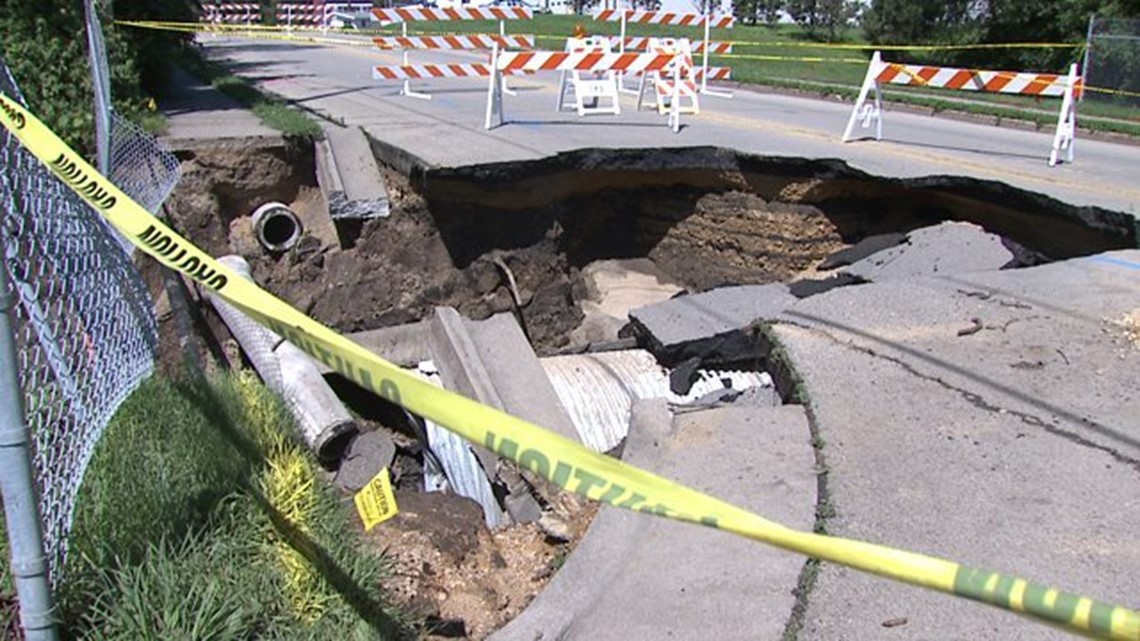 Downpours collapse street in Dixon, Illinois | wqad.com