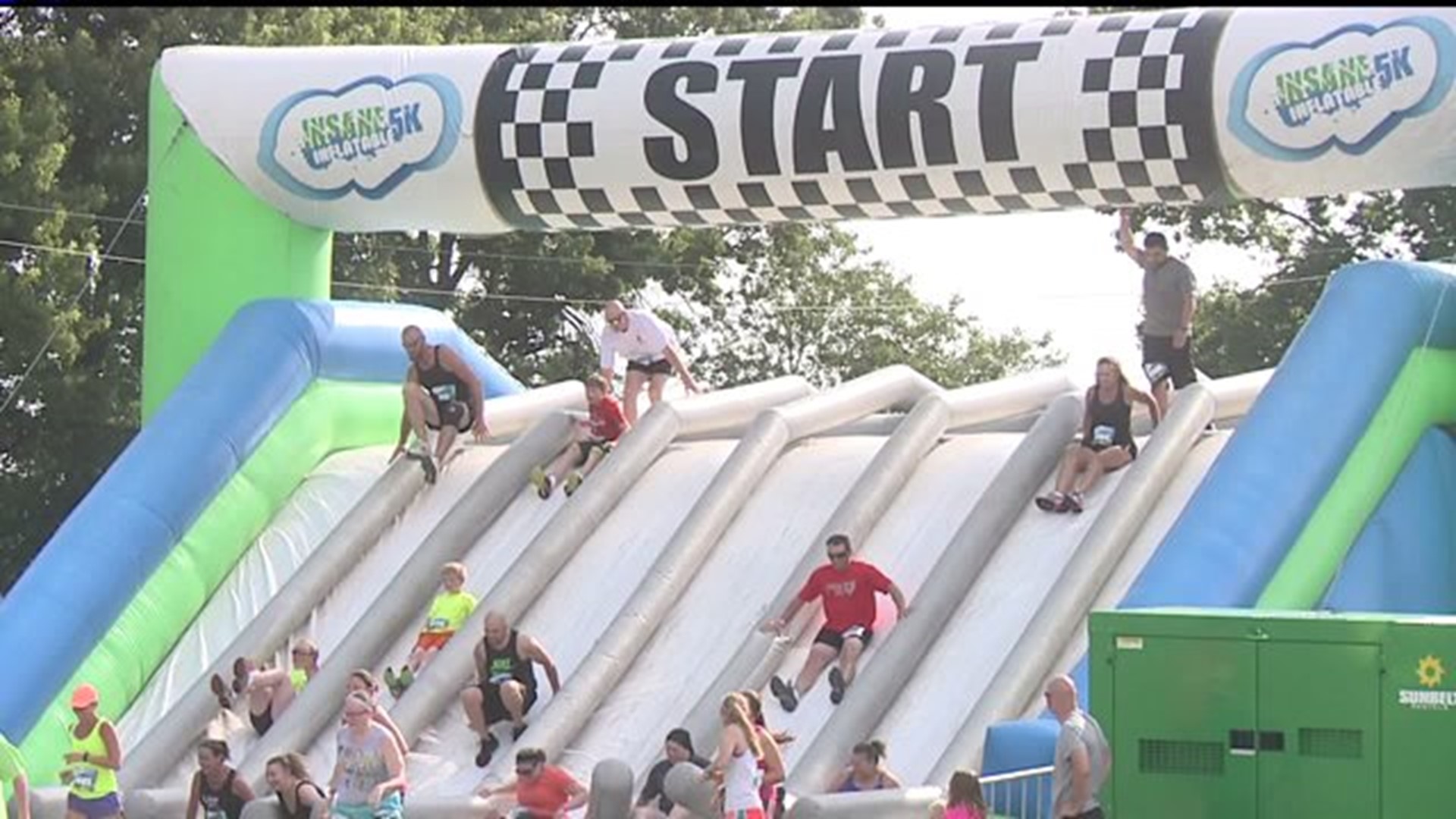 Insane Inflatable 5k participants get an extra workout | wqad.com