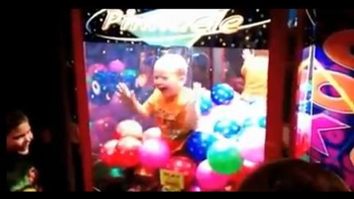 Viral Video: Boy climbs into claw machine | wqad.com