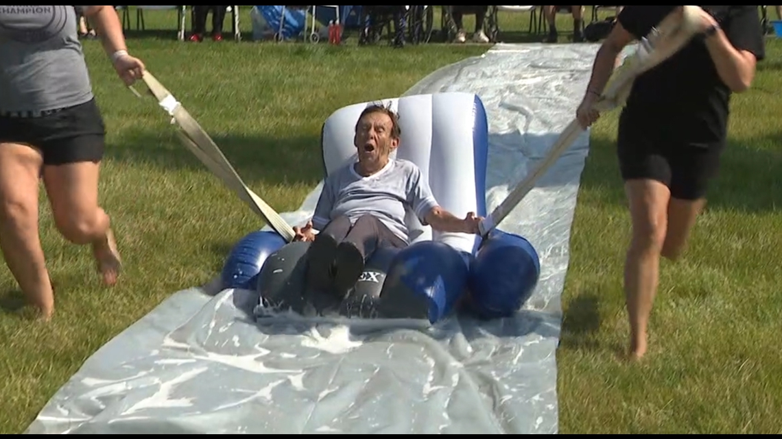 Senior Star residents slide down hill in huge inflatable chair | wqad.com
