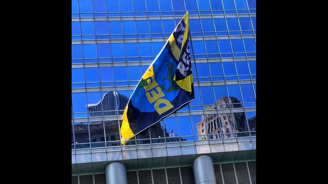 6 charged after hanging banner on Trump Tower | wqad.com