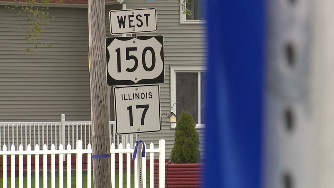 Volunteers tie ribbons along Route 150 to honor fallen officer | wqad.com
