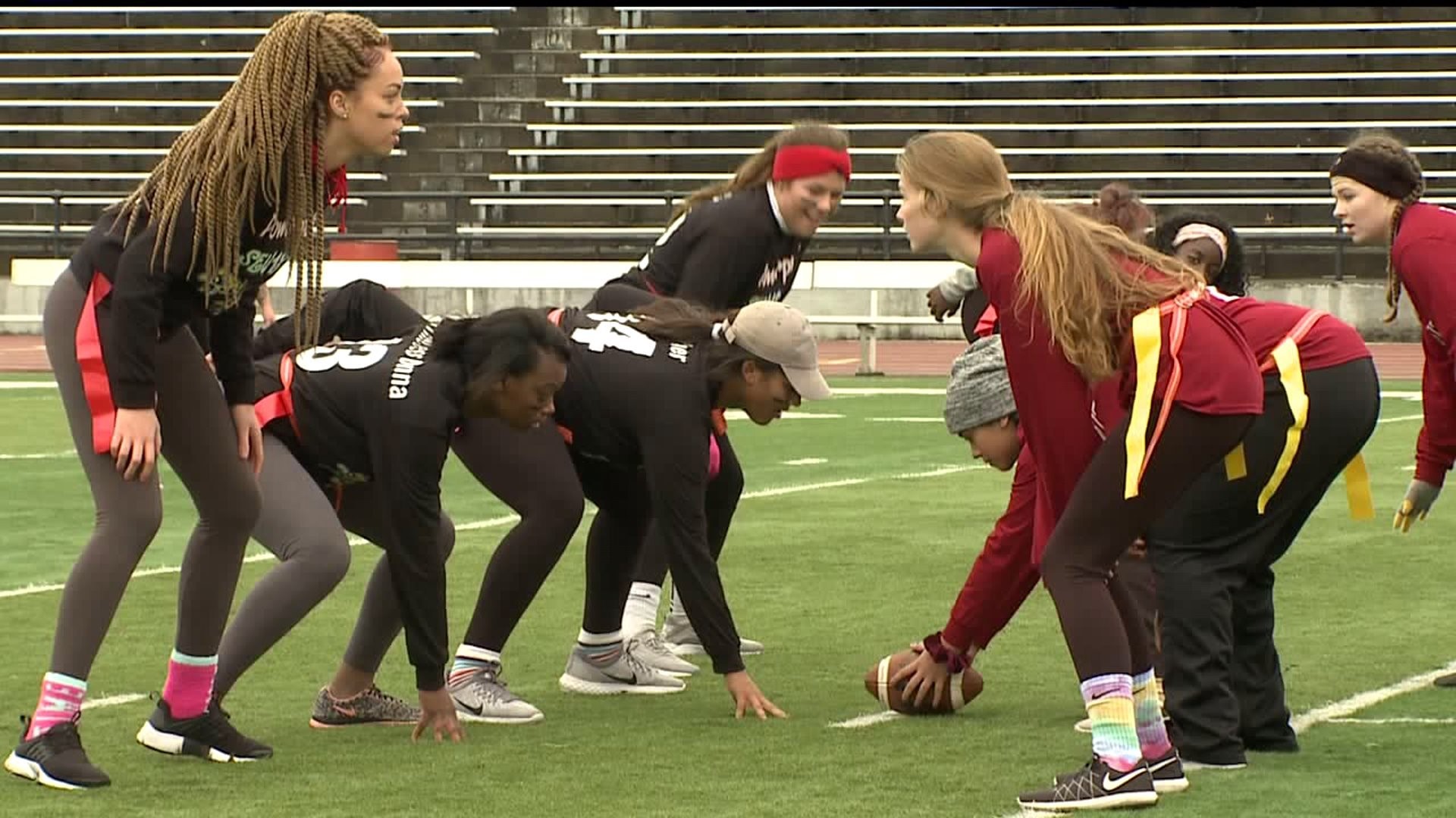 RI Powder Puff game collects can goods for student hunger drive | wqad.com