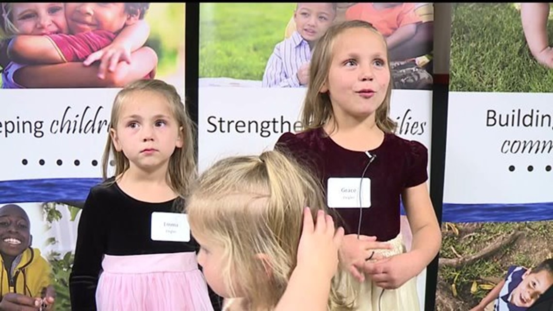 Adorable sisters help accept family’s award for being a local adoptive ...